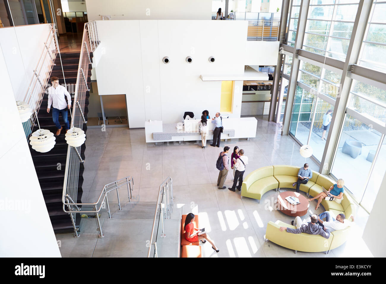 Reception Area Of Modern Office Building With People Stock Photo - Alamy