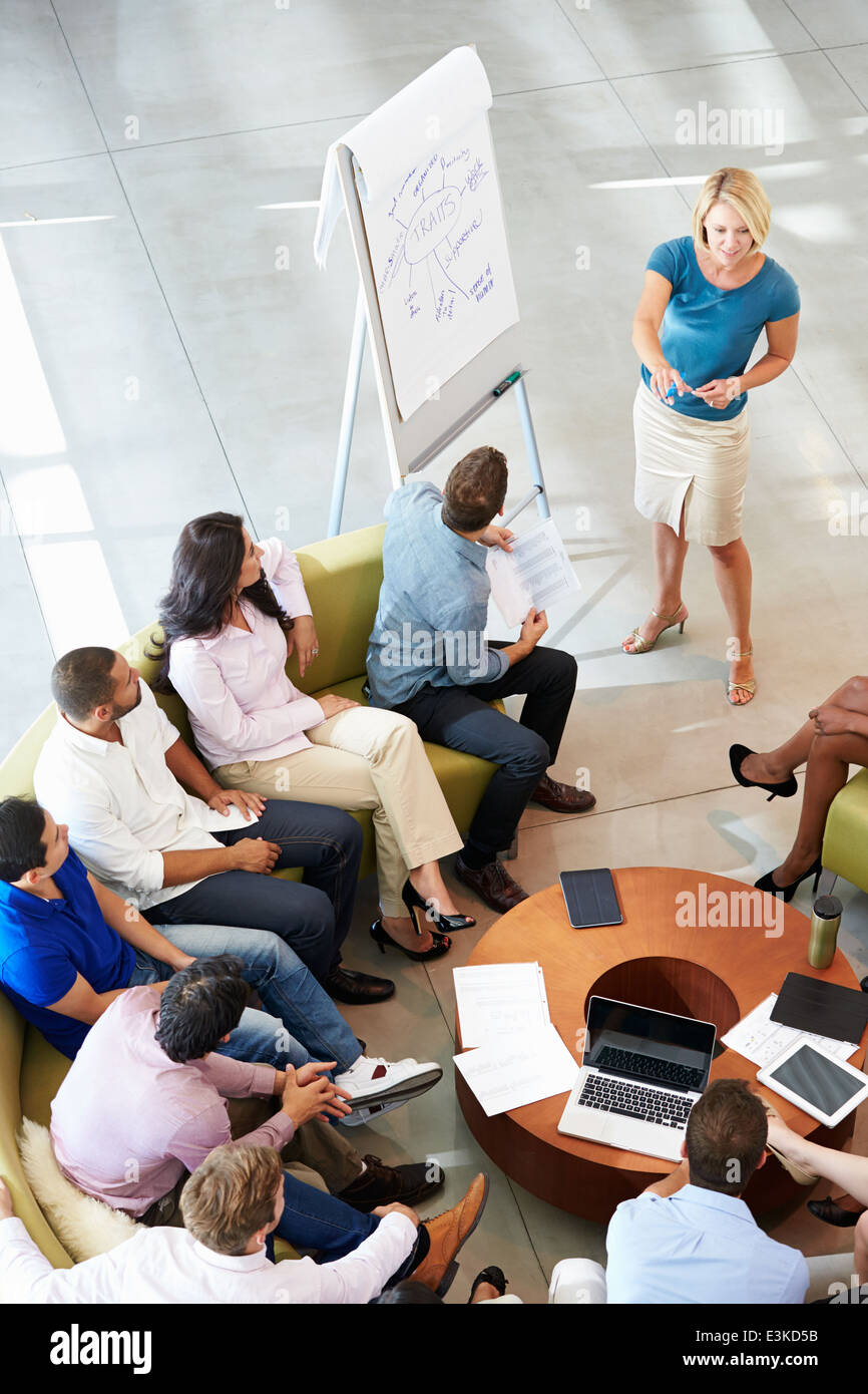 Businesswoman Making Presentation To Office Colleagues Stock Photo - Alamy