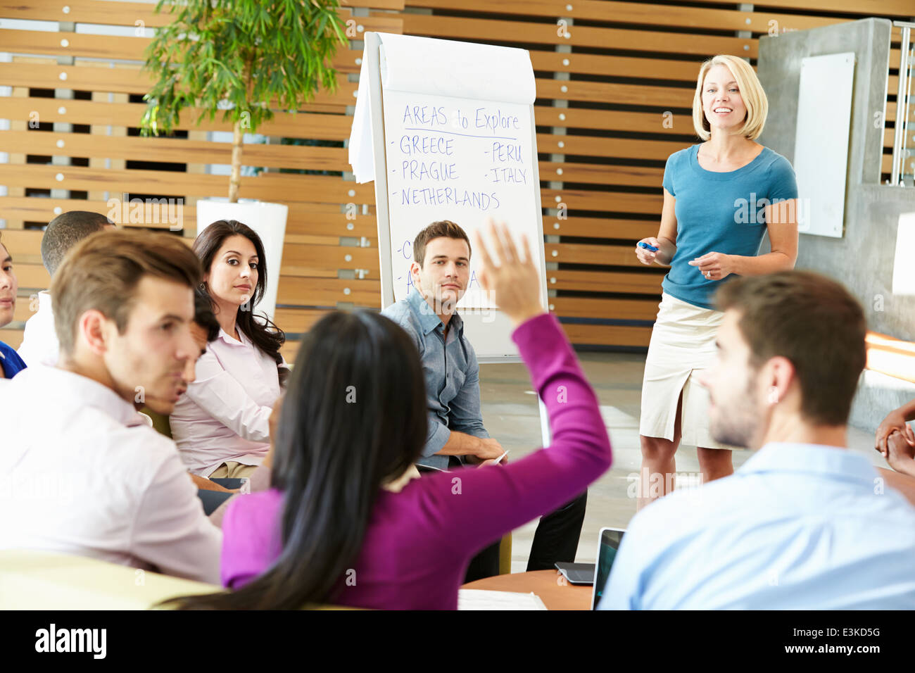 Businesswoman Making Presentation To Office Colleagues Stock Photo - Alamy