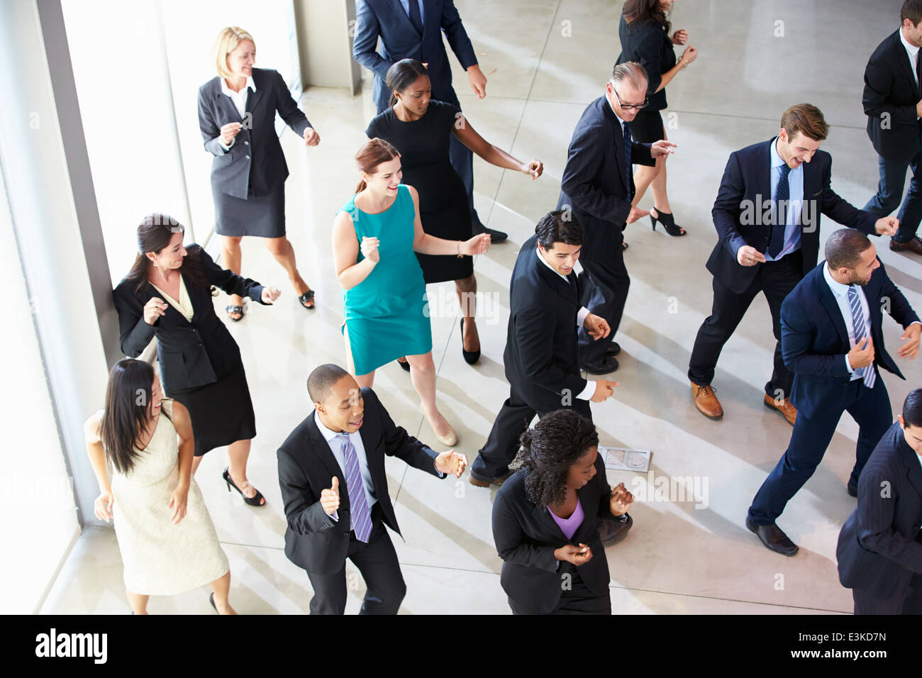 Overhead View Of Businesspeople Dancing In Office Lobby Stock Photo - Alamy