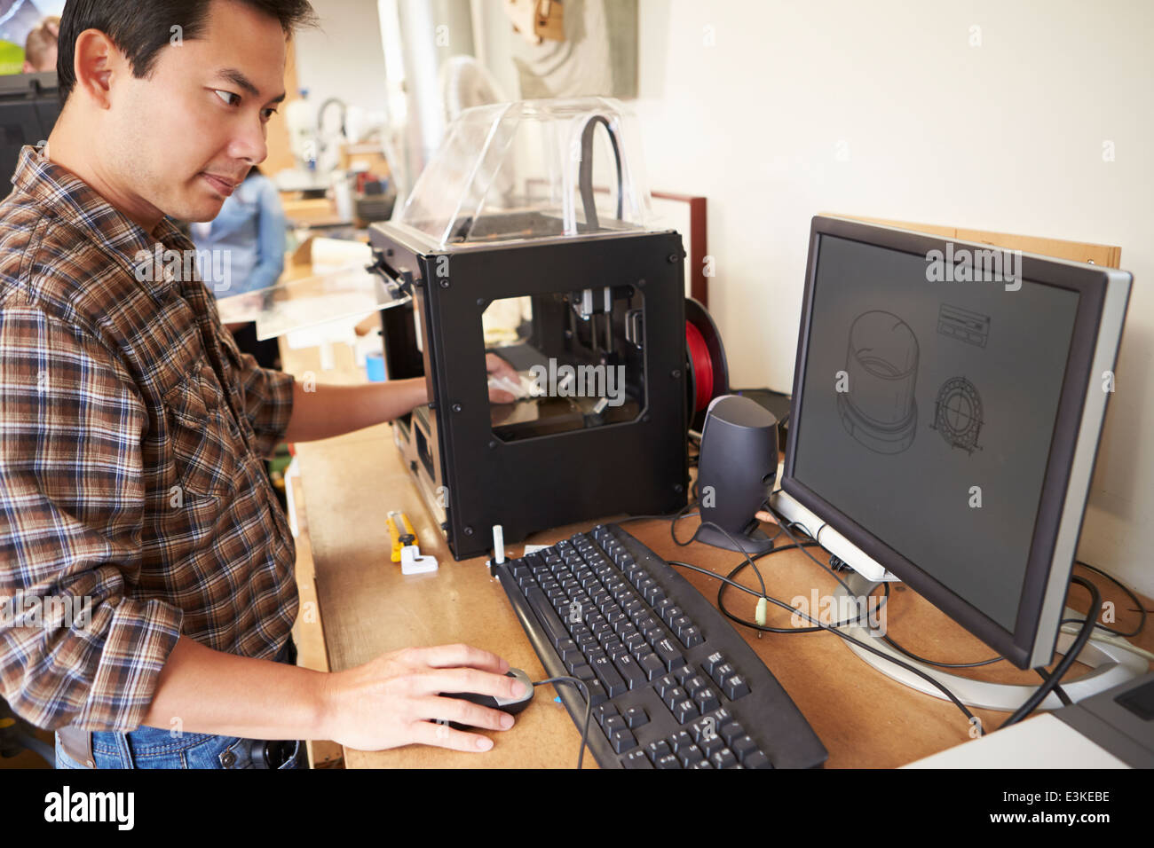 Male Architect Using 3D Printer In Office Stock Photo - Alamy