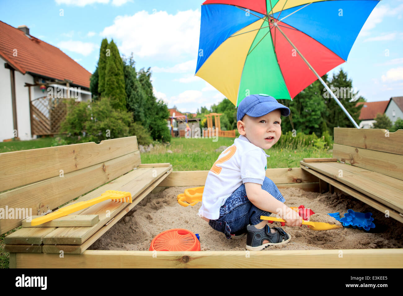 little male child playing in the sandbox Stock Photo - Alamy