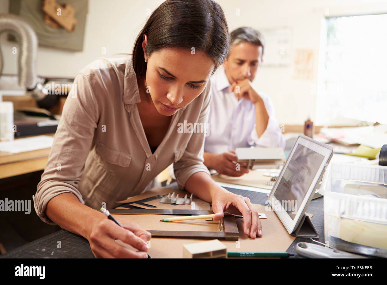 Two Architects Making Models In Office Using Digital Tablet Stock Photo ...