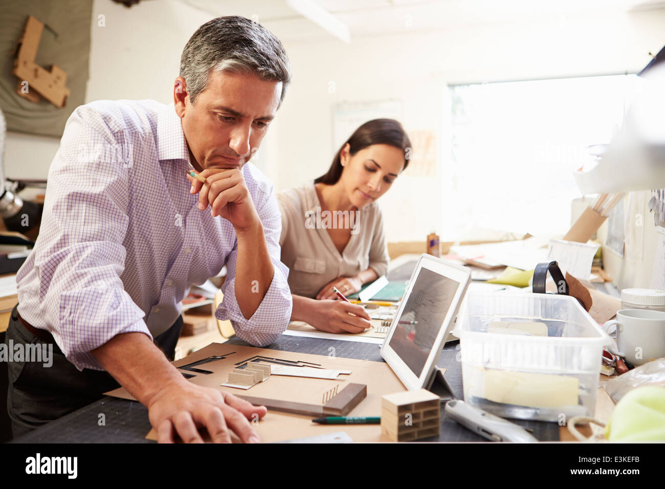 Two Architects Making Models In Office Using Digital Tablet Stock Photo ...