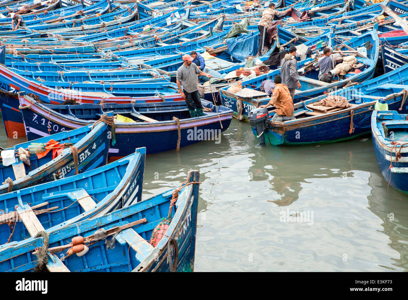 Traditional, blue painted fishing boats in the harbour at Essaouira on ...