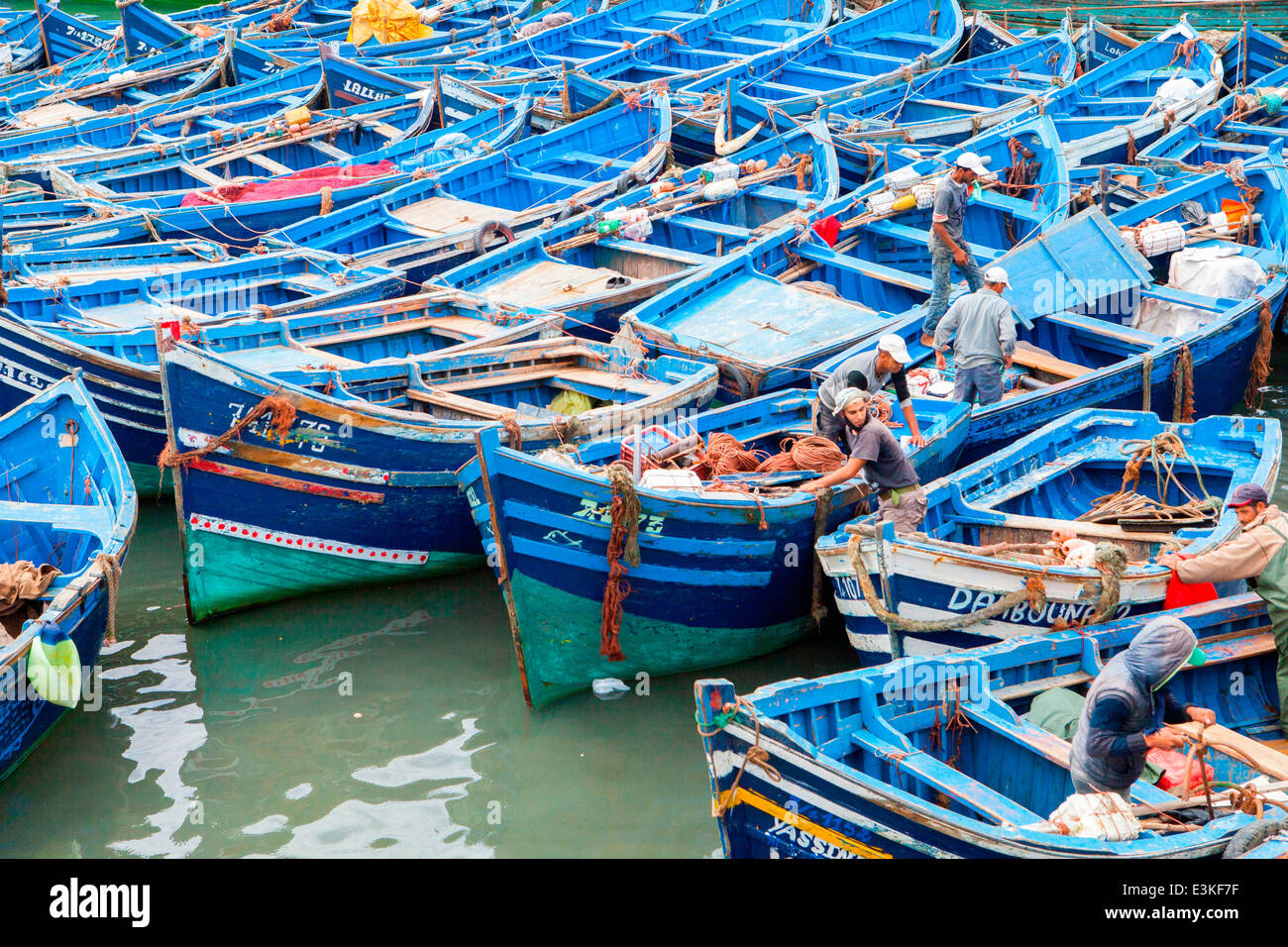 Traditional, blue painted fishing boats in the harbour at Essaouira on ...