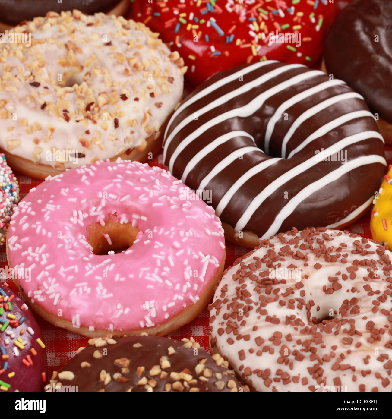 Group of many colored donuts side by side Stock Photo - Alamy