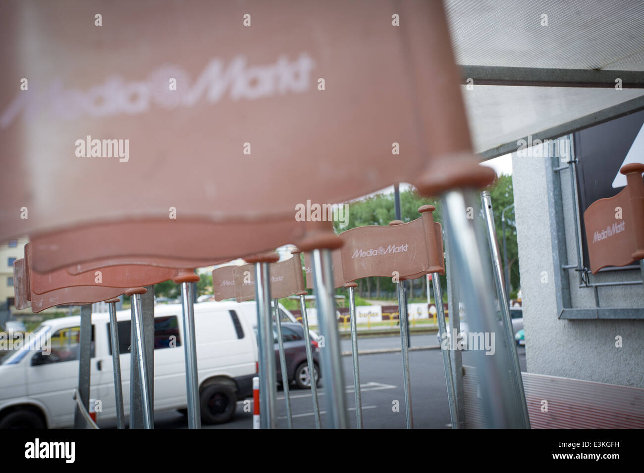 Flags on top of trolleys at the Media Markt are seen Stock Photo - Alamy