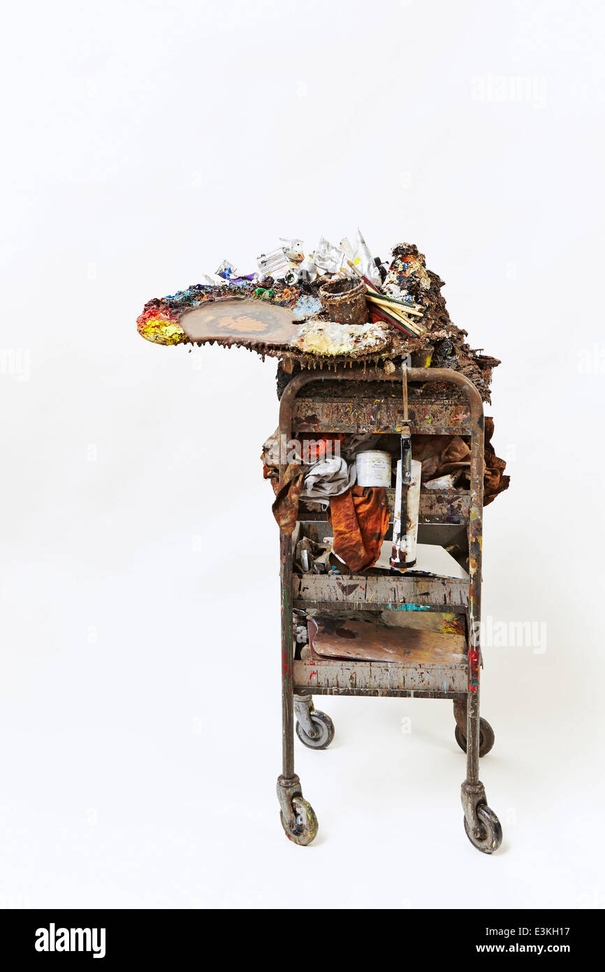 Artist's studio trolley with easel, palette and brushes on white ...