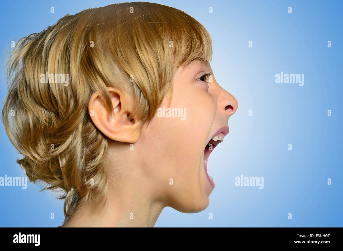 Closeup of adorable young boy screaming Stock Photo - Alamy