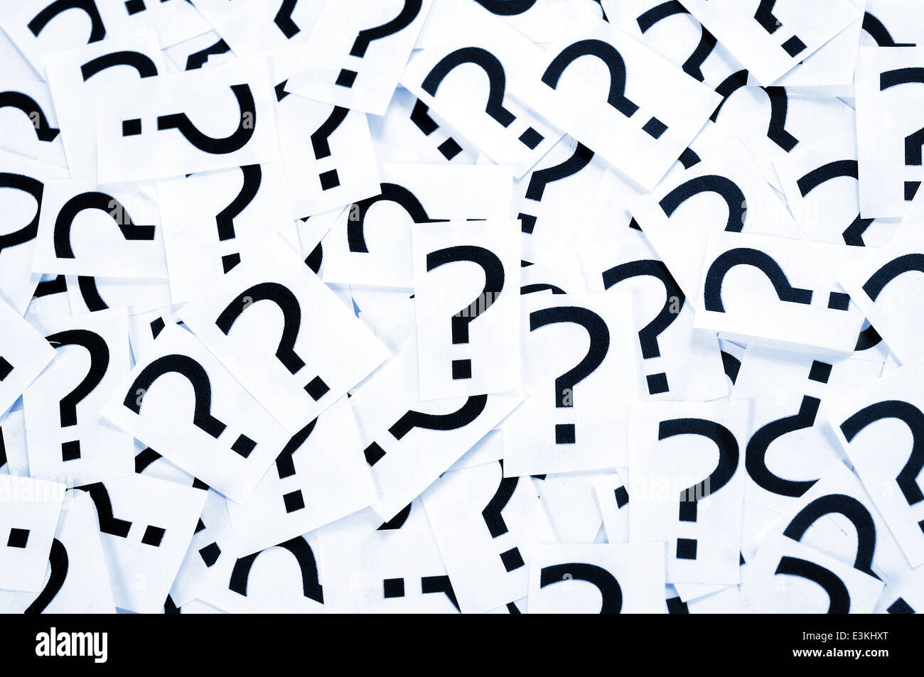 Many black question mark on papers Stock Photo - Alamy