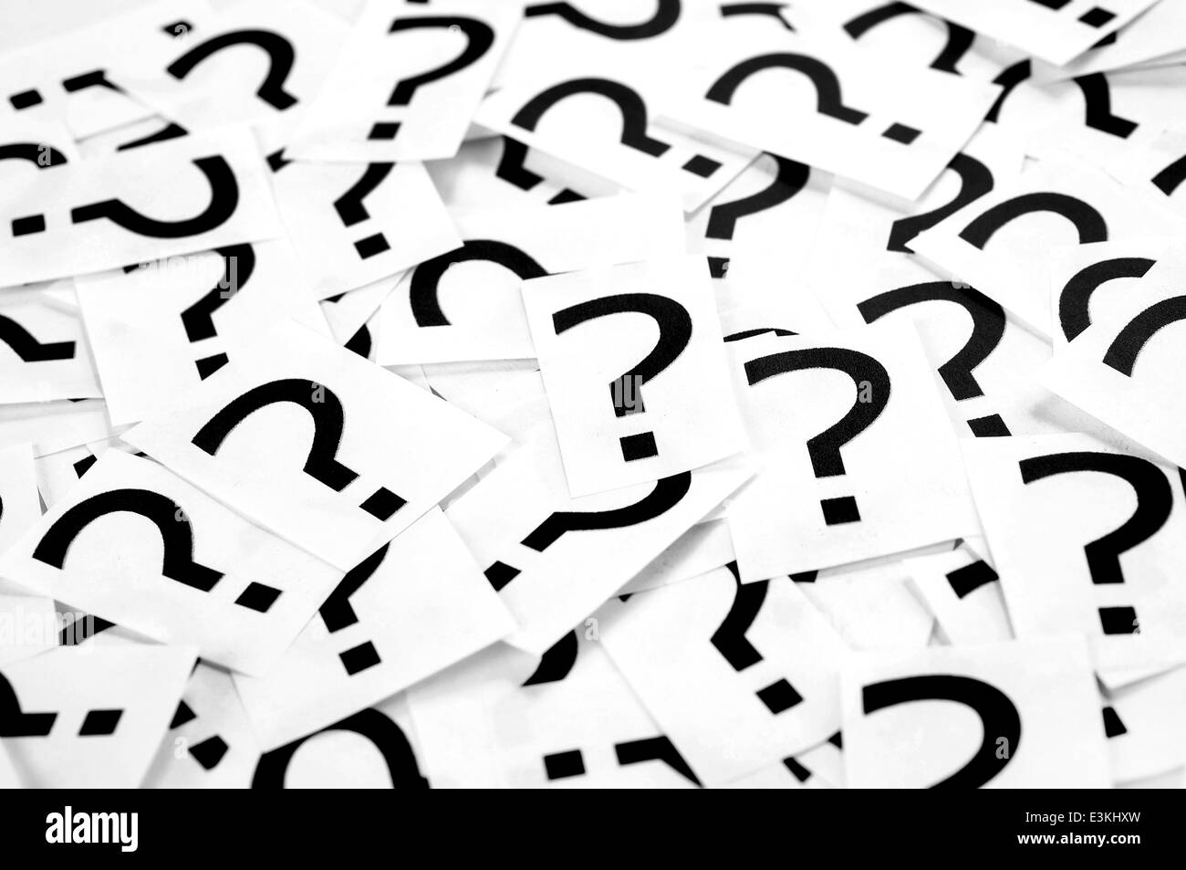 Many black question mark on papers Stock Photo - Alamy