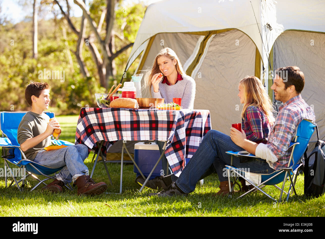 Family Enjoying Camping Holiday In Countryside Stock Photo - Alamy