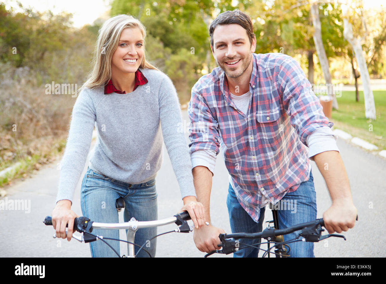 Couple On Cycle Ride In Countryside Stock Photo - Alamy