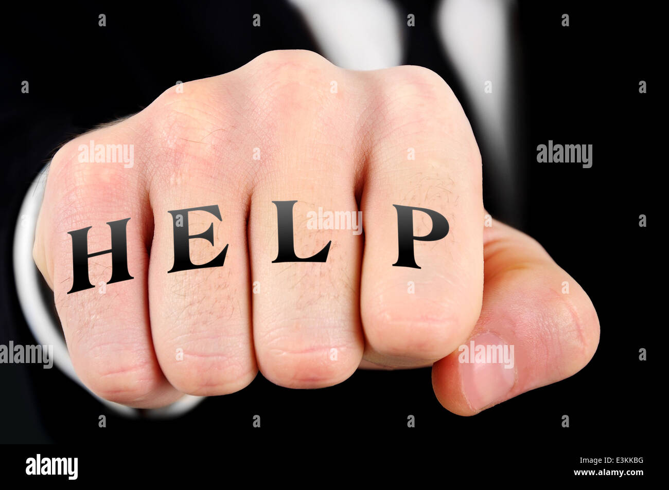 Help word on business man fist Stock Photo - Alamy