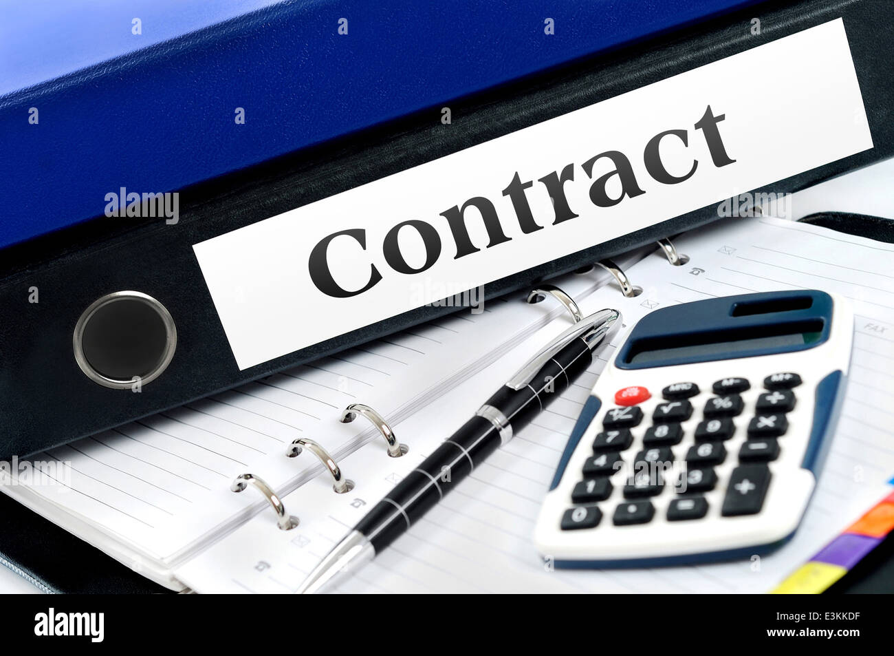 Contracts folder with office tools Stock Photo - Alamy