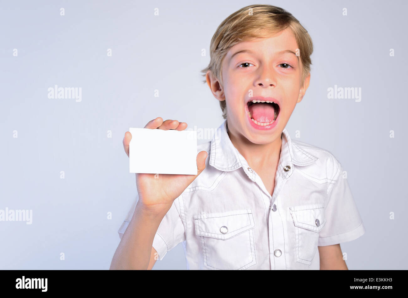 young boy holding note and screaming Stock Photo - Alamy