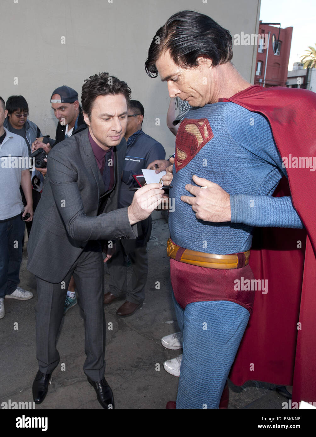 June 23, 2014 - Hollywood, California, U.S - ZACH BRAFF signs the shirt ...