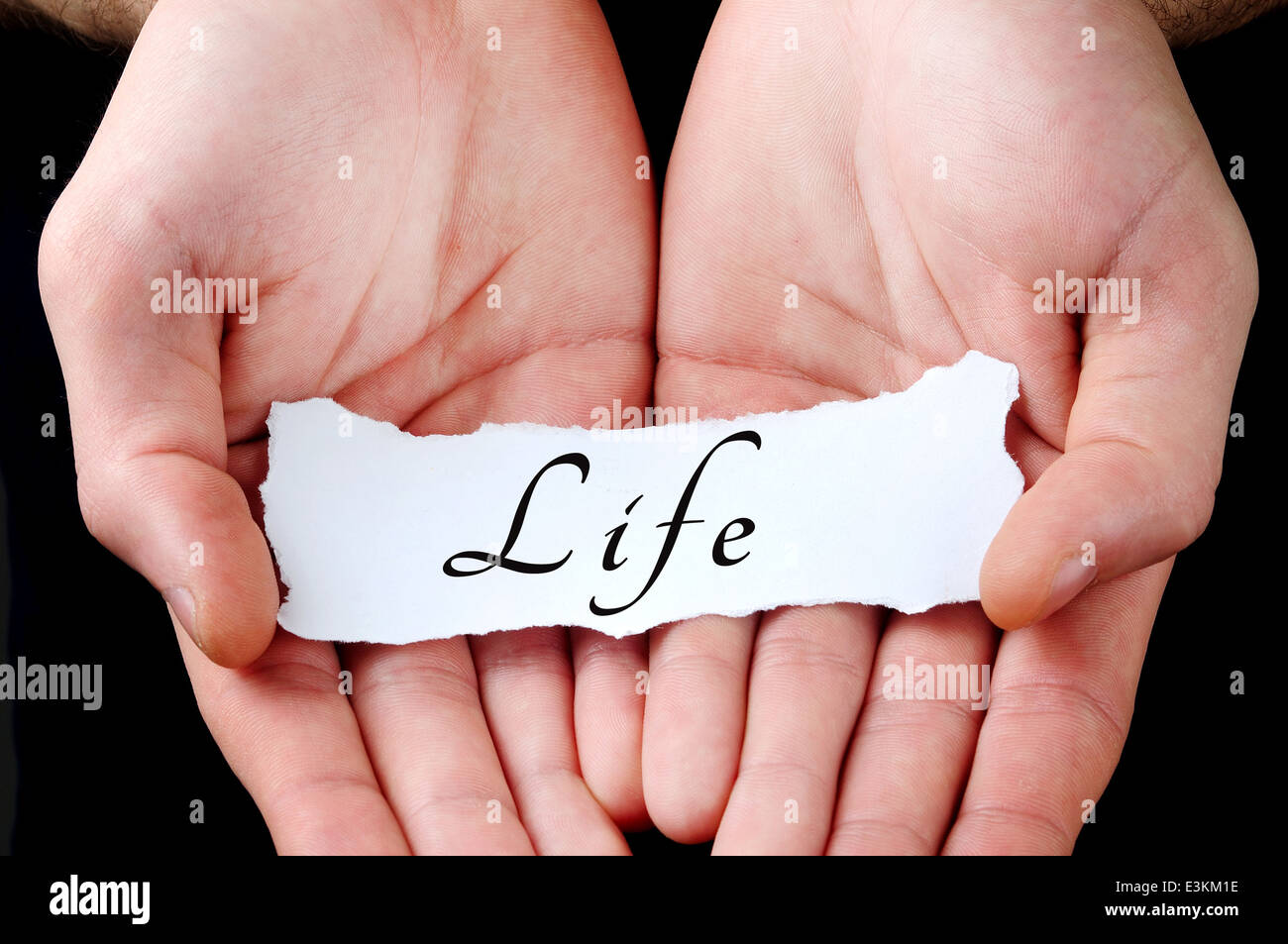 Man holding life word in palm Stock Photo - Alamy