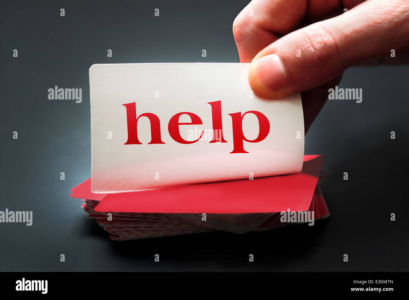 Help card on black table Stock Photo - Alamy