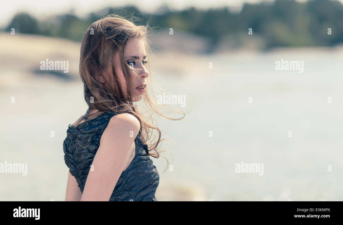 Longing woman, beautiful young woman looks into the distance Stock ...