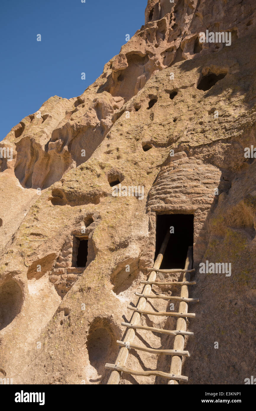 A wooden ladder leads to a cliff dwelling in Bandelier National ...
