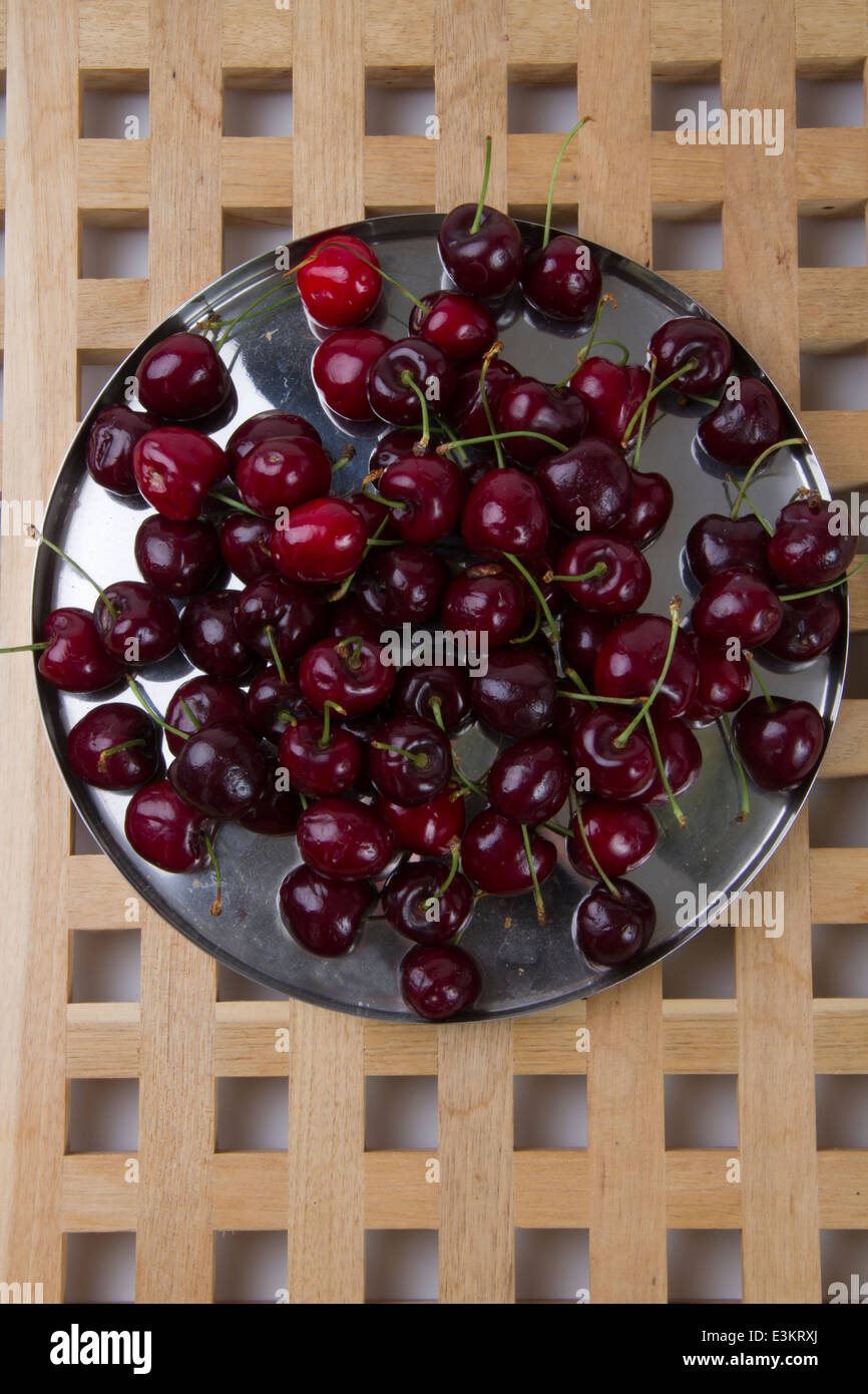 Dish of black cherries Stock Photo - Alamy