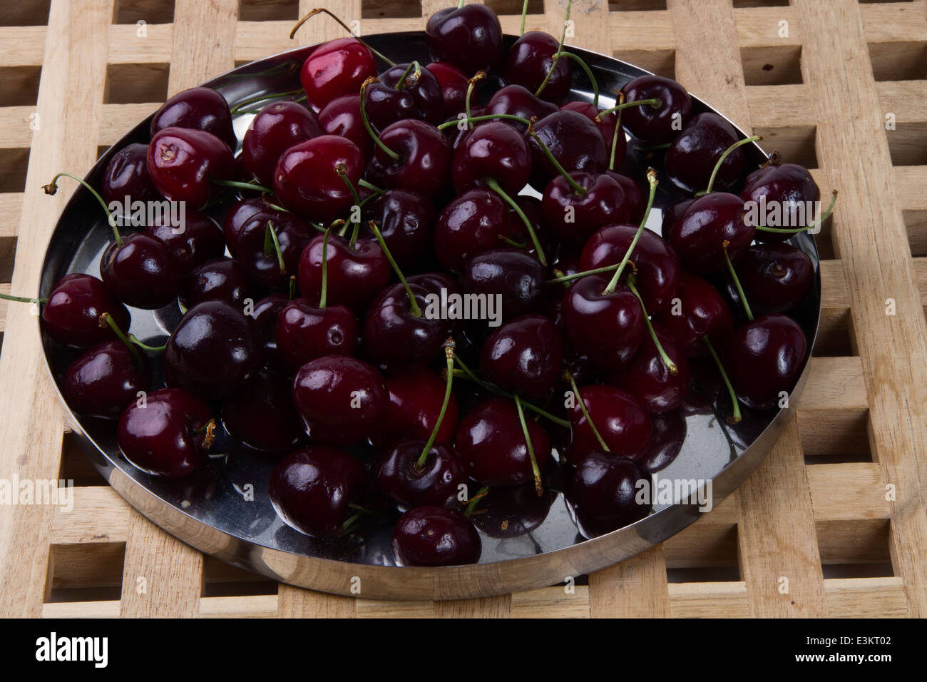 Dish of black cherries Stock Photo - Alamy