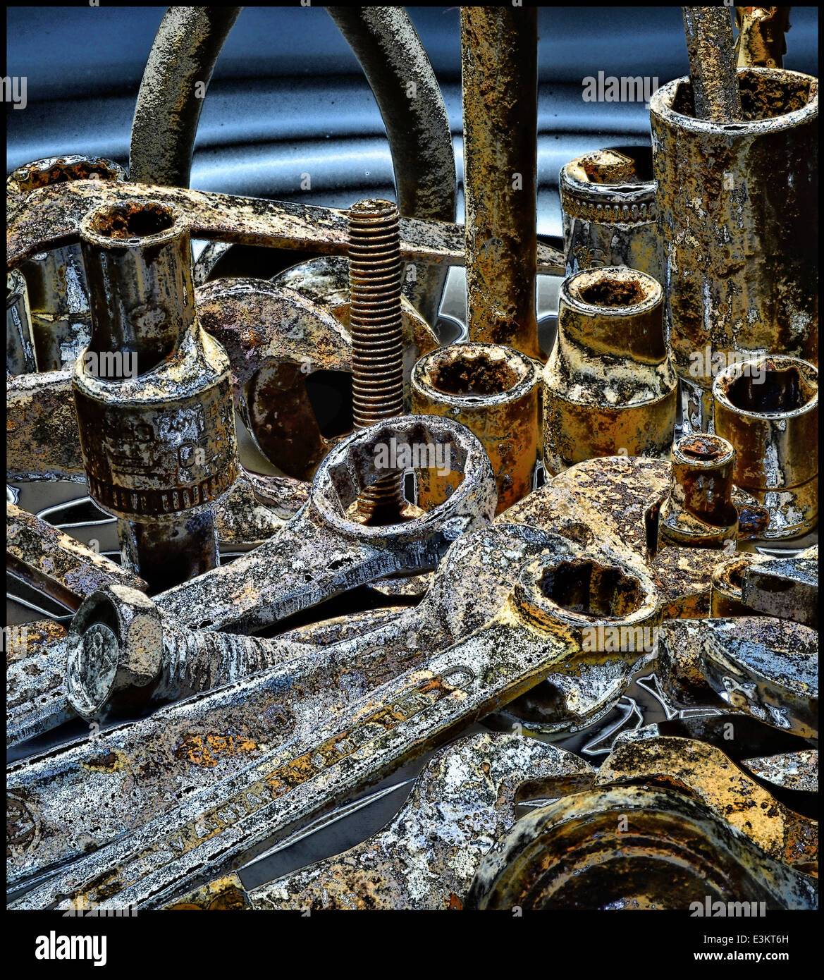 This is a still life image of some old rusty bolts,sockets and spanners ...
