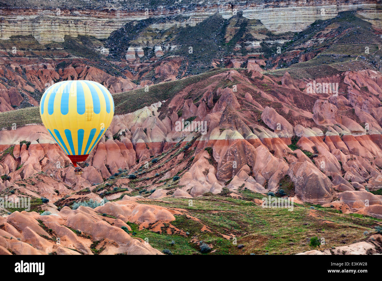 View of the air balloon flying over rock formation Stock Photo - Alamy