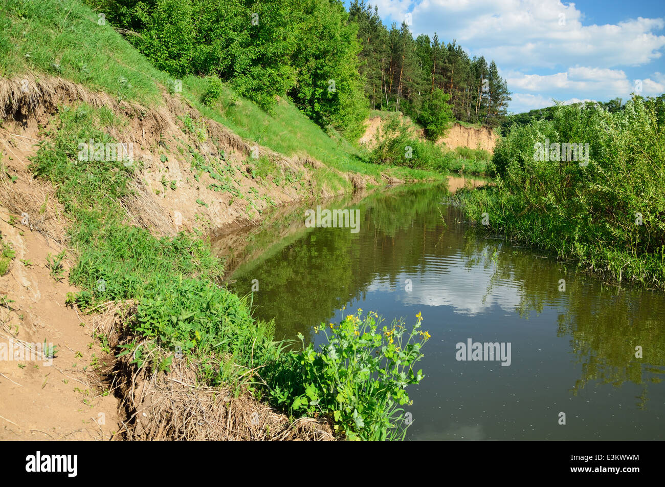 Steep coast of the twisting river Stock Photo - Alamy