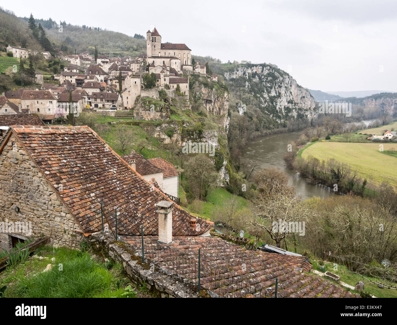 St Cirq Lapopie with the Lot River below the cliff defenses. An ancient ...