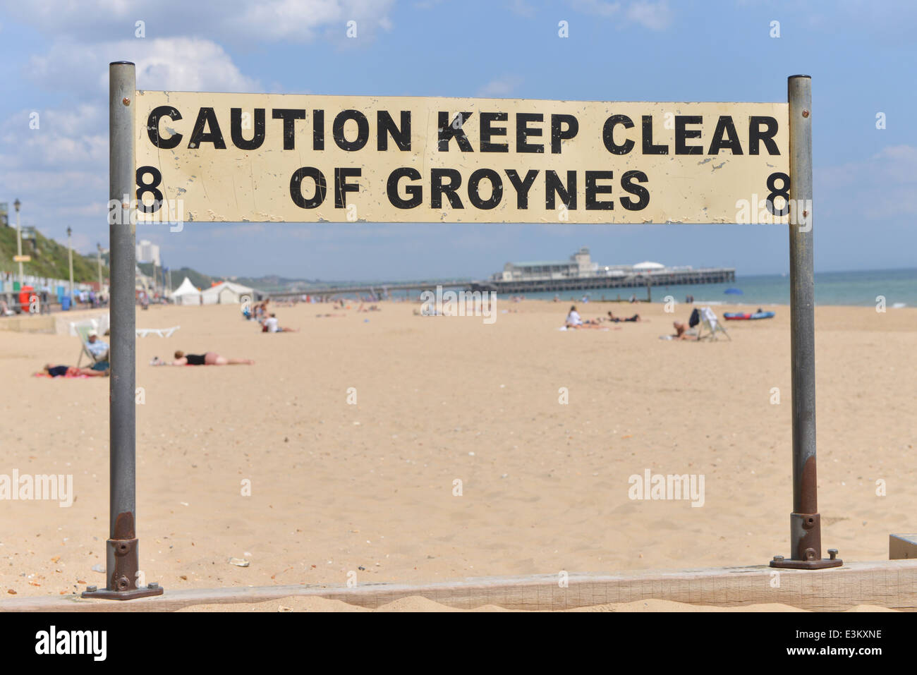 Bournemouth beach groynes sign sand sunshine pier sea sky Stock Photo ...