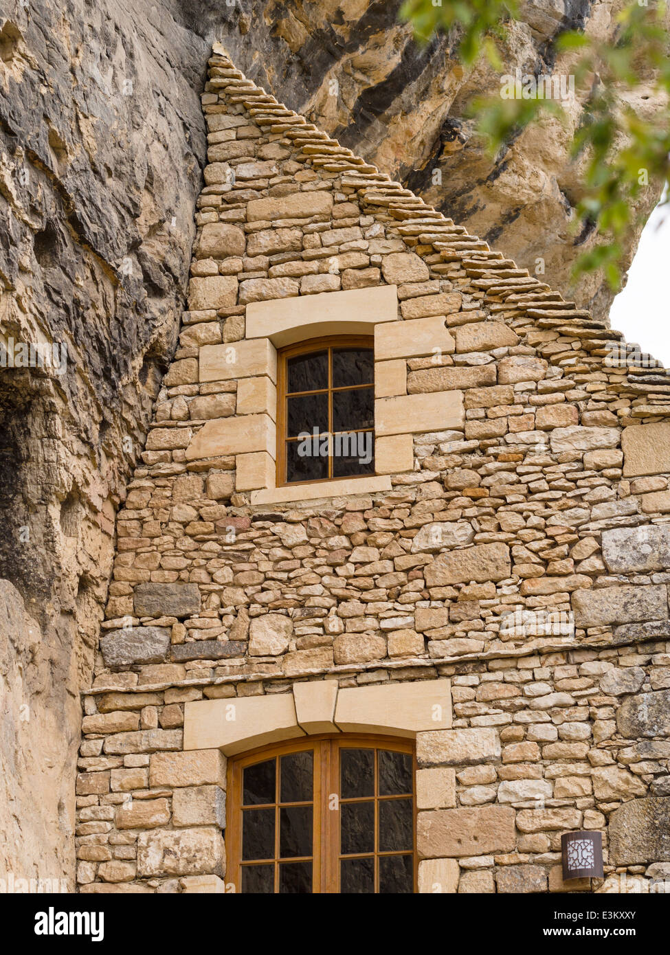 Up against the Cliff: A house conforms to the cliff face. A house seems ...