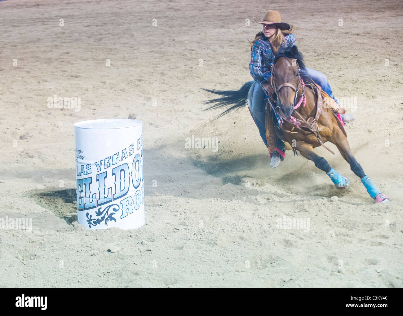 Cowgirl Participating in a Barrel racing competition at the Helldorado ...