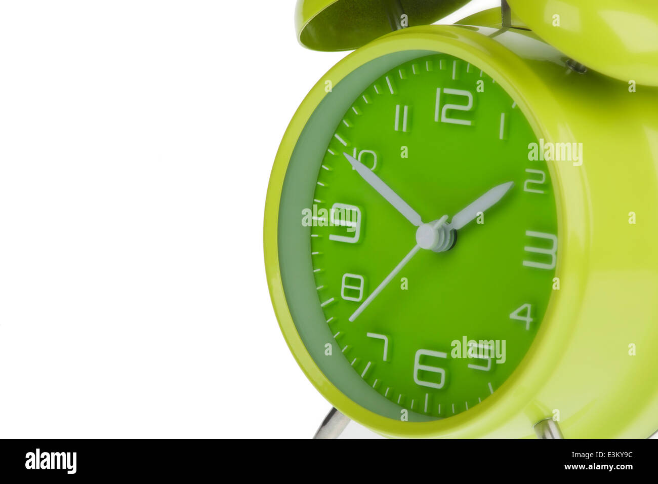 Green alarm clock with the hands at 10 and 2 isolated on a white ...