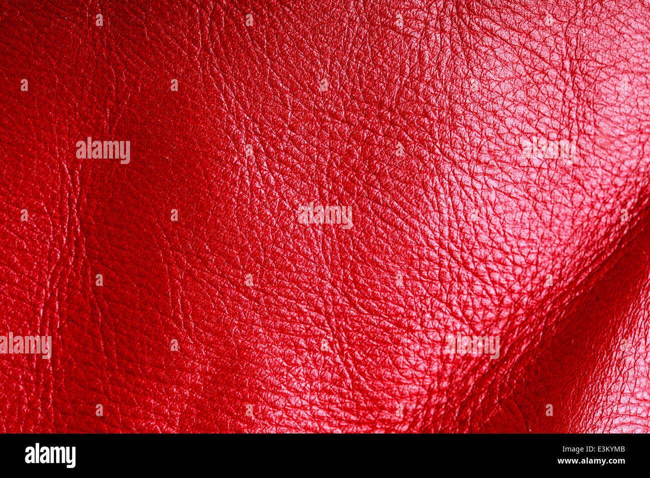 Texture of folds vivid red skin leather background Stock Photo - Alamy