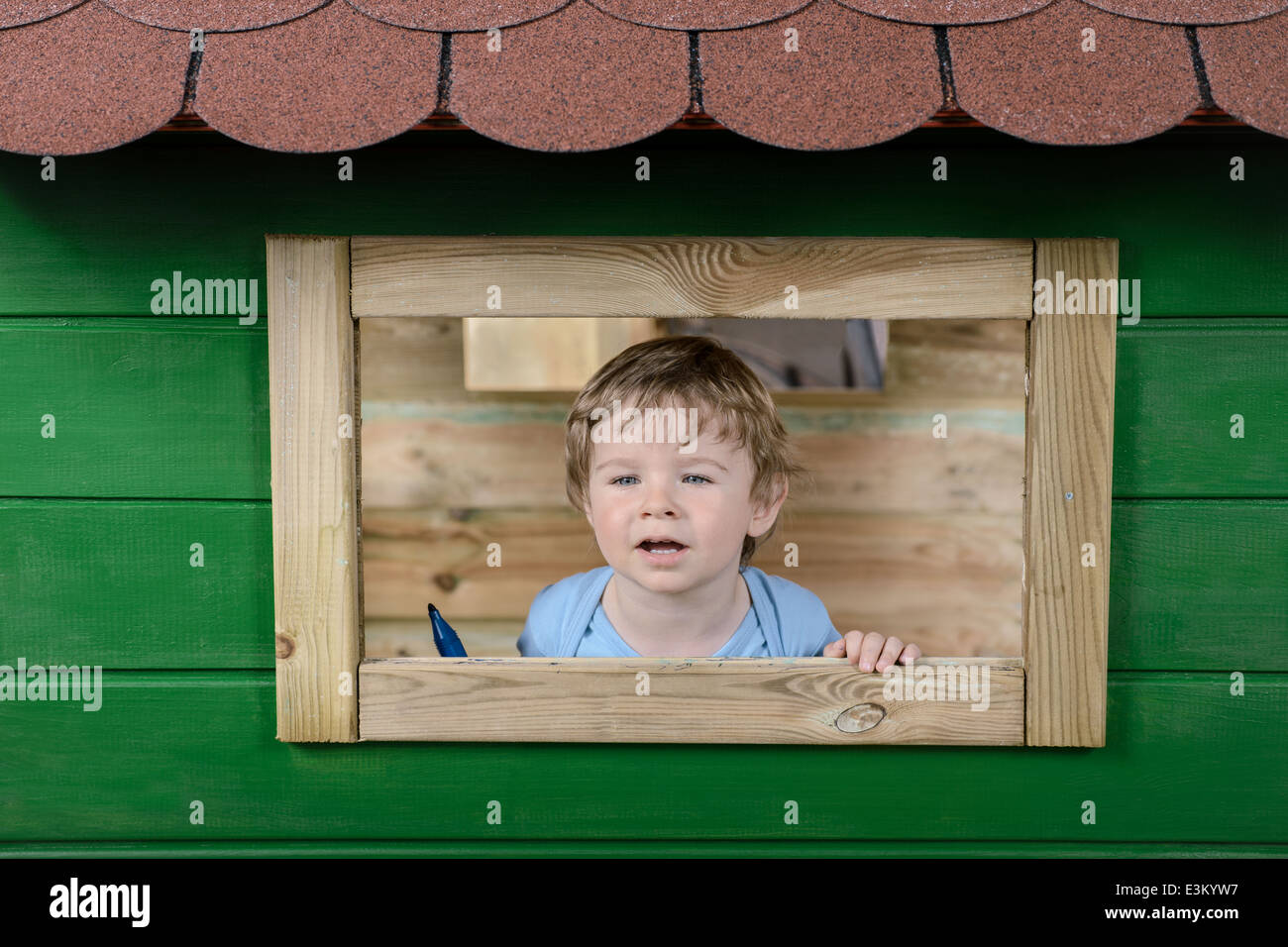 Kid looking out of the window of his play house Stock Photo - Alamy