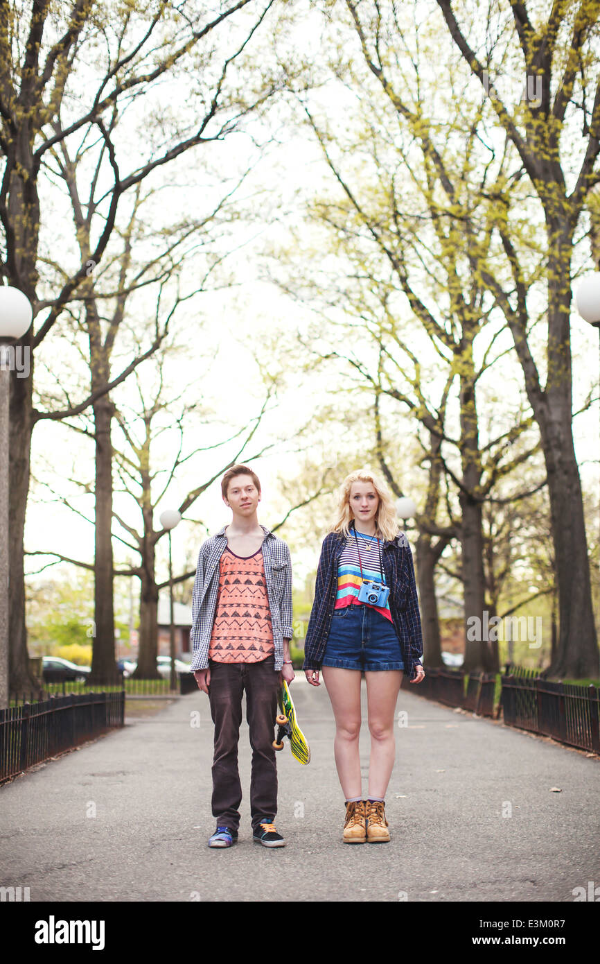 Portrait of two friends standing in park, Massachusetts, USA Stock ...