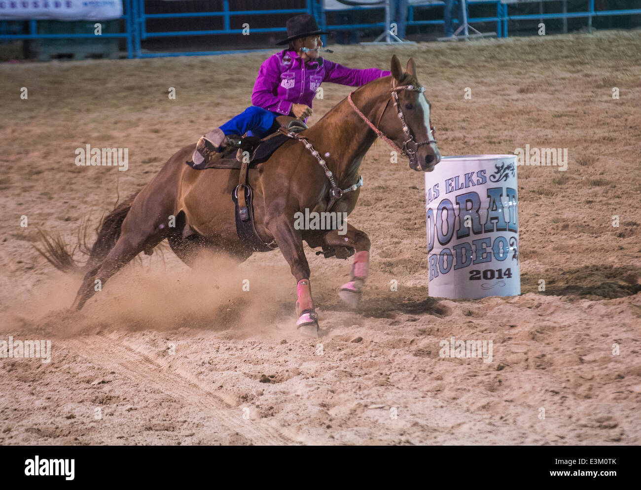 Cowgirl Participating in a Barrel racing competition at the Helldorado ...