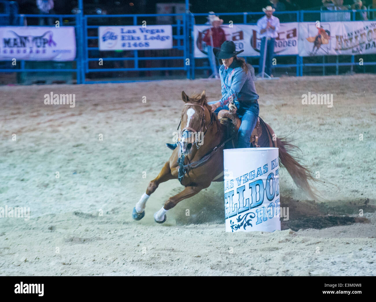 Cowgirl Participating in a Barrel racing competition at the Helldorado ...