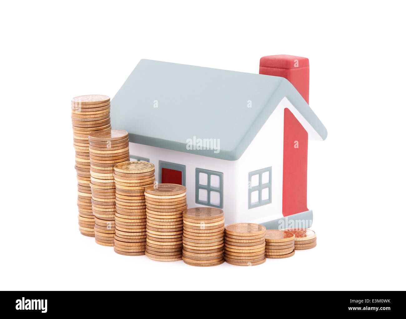 House with stack of coins. Clipping path included Stock Photo - Alamy
