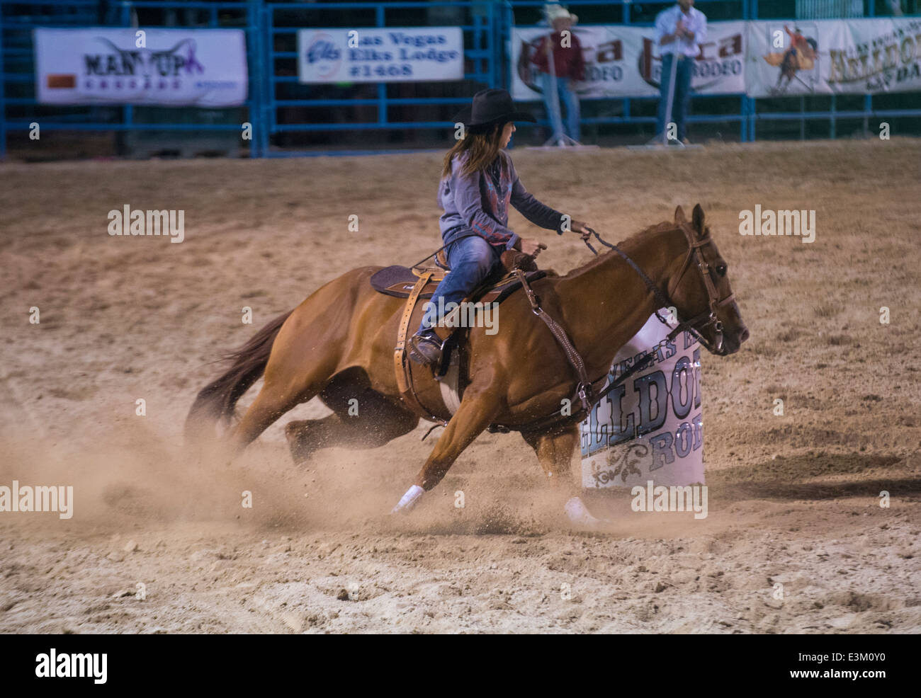 Cowgirl Participating in a Barrel racing competition at the Helldorado ...
