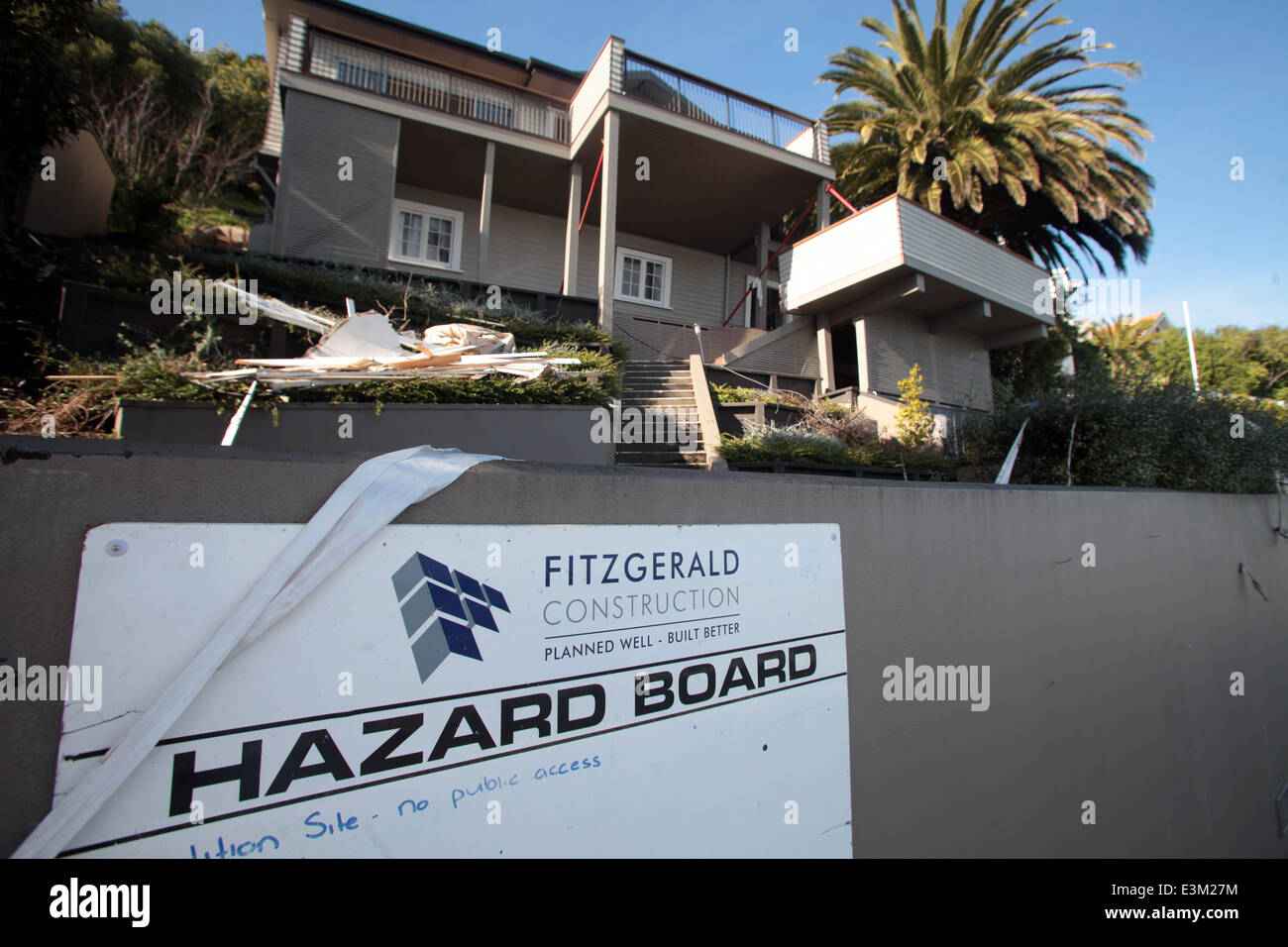 Hazard board at a house due to be demolished following landslip caused ...