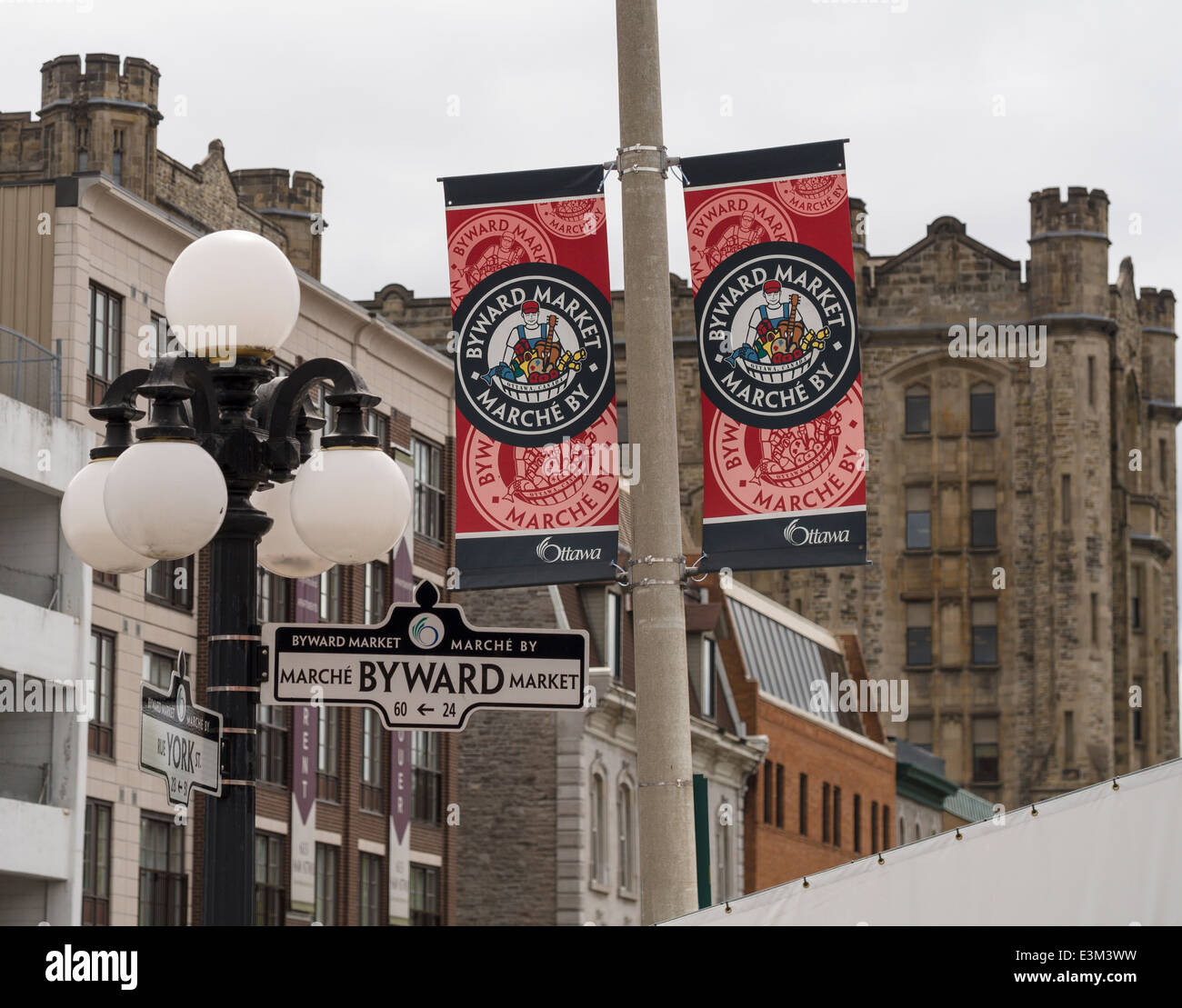 Byward Market banner on a lamp post, Byward Market street sign below. A ...