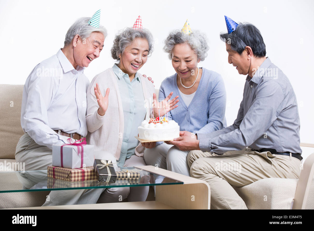 Senior adults having birthday party Stock Photo - Alamy