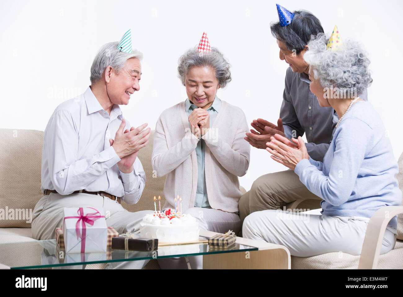 Senior adults having birthday party Stock Photo - Alamy