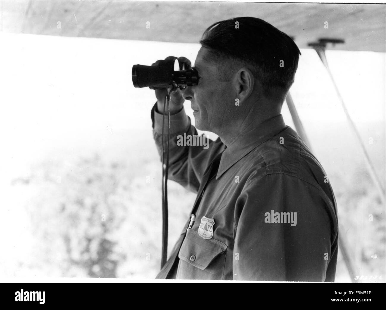 A historical photograph of a Forest Service employee from 1939 working ...