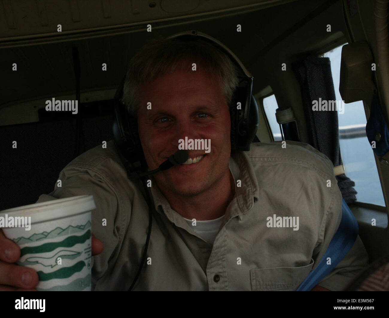 U.S. Fish and Wildlife Service pilot Brian Lubinski flies a plane as ...