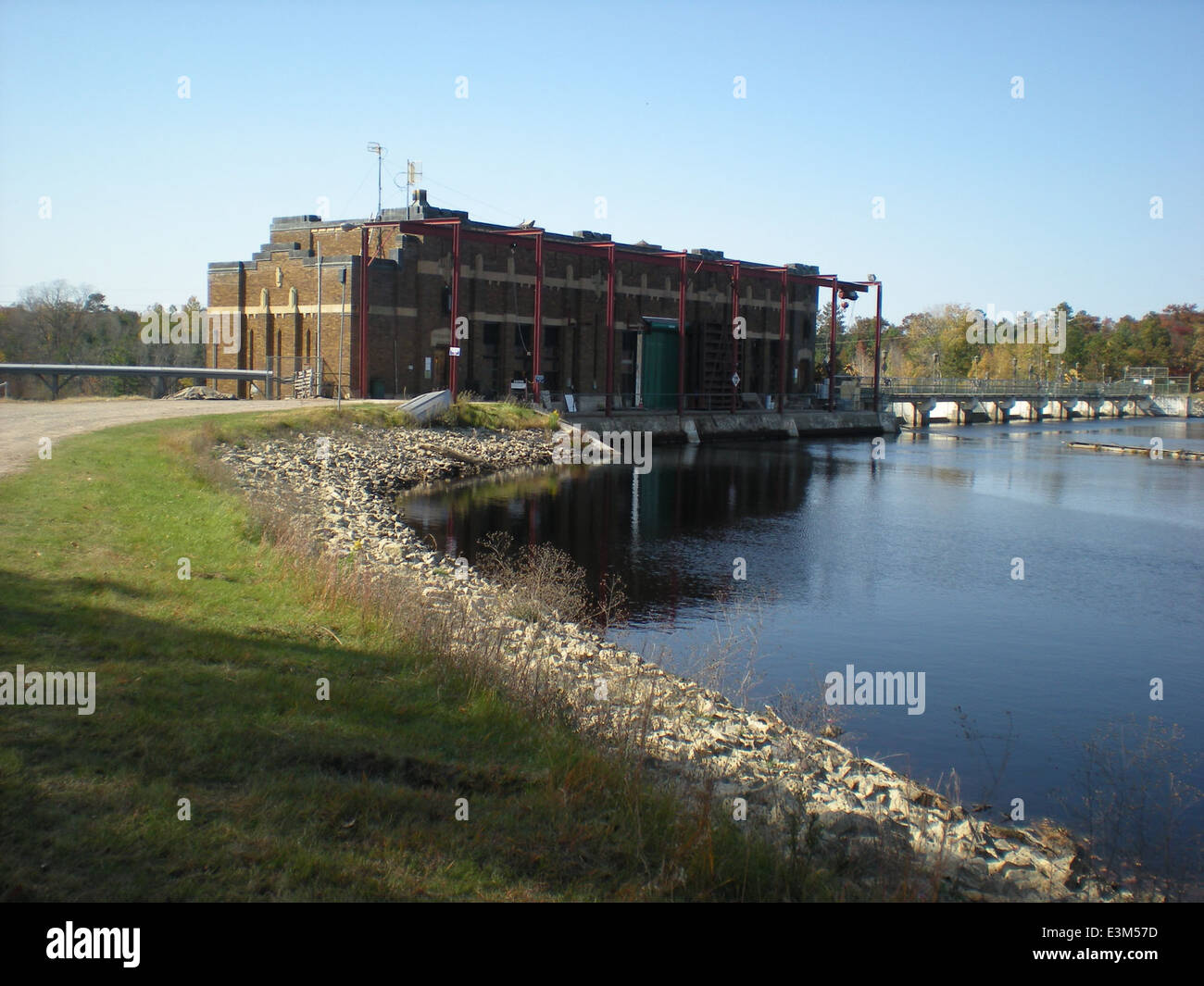 The White Rapids Dam is located on the Menominee River in Michigan. The ...